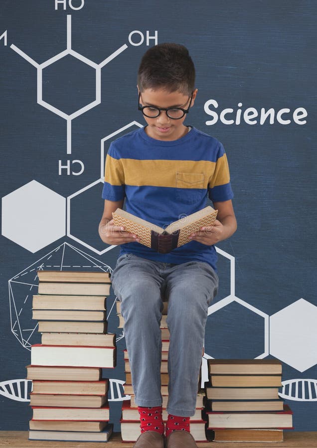 Student Boy on a Table Reading Against Blue Blackboard with Science ...