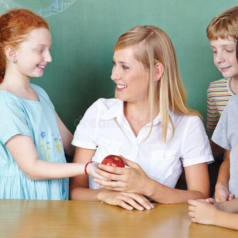 Student Bringing Teacher Apple Stock Image - Image of donate, learn ...