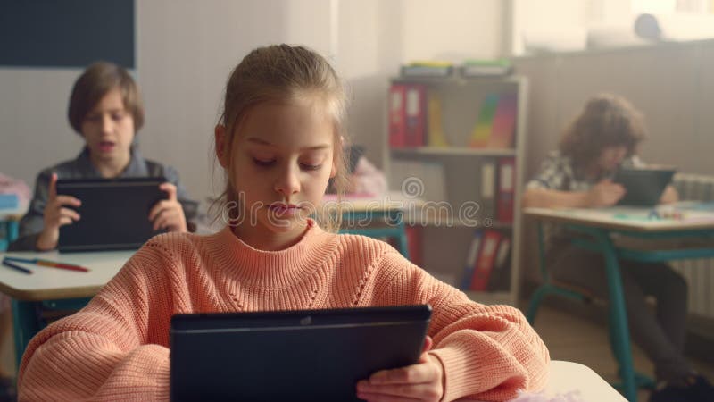 Student Browsing Internet Online on Digital Tablet during Lesson at ...