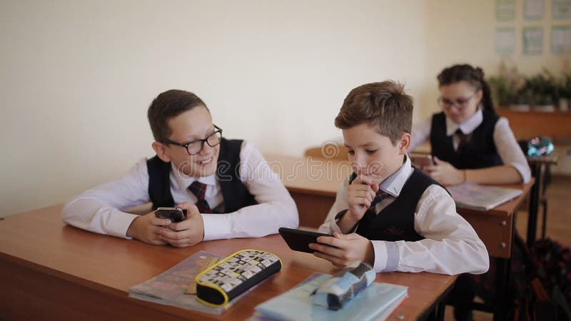 High School Students Play Games on Their Phone during Class. Stock ...