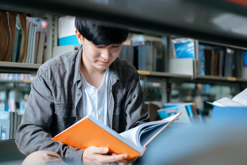 Student College Opening and Reading a Book at Library Stock Photo ...