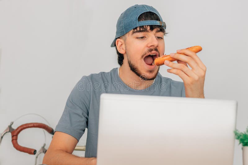 Student with Computer at Desk Eating Pizza Stock Image - Image of ...
