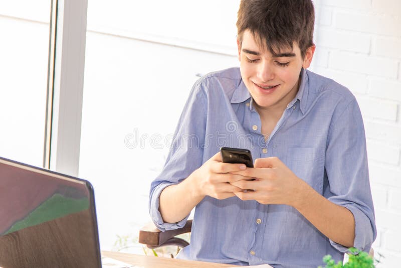 Student with Computer and Mobile Phone Stock Image - Image of handsome ...