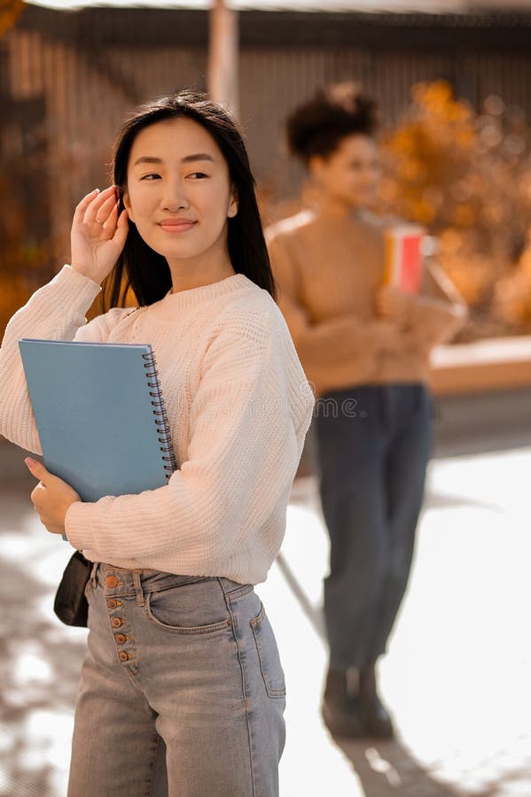 A Cute Long-haired Asian Girl with a Book Stock Photo - Image of pretty ...