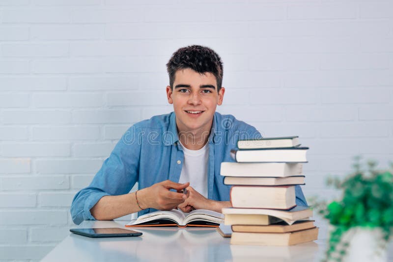 Student at the desk stock photo. Image of indoors, bookshelf - 226701304