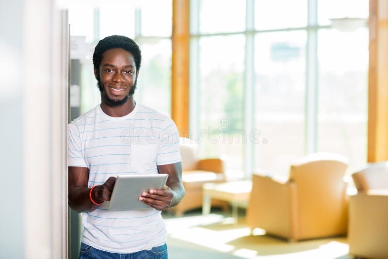 Happy African Male Student with Laptop in Library Stock Image - Image ...