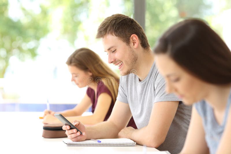 Student Distracted with Mobile Phone at Classroom Stock Photo - Image ...
