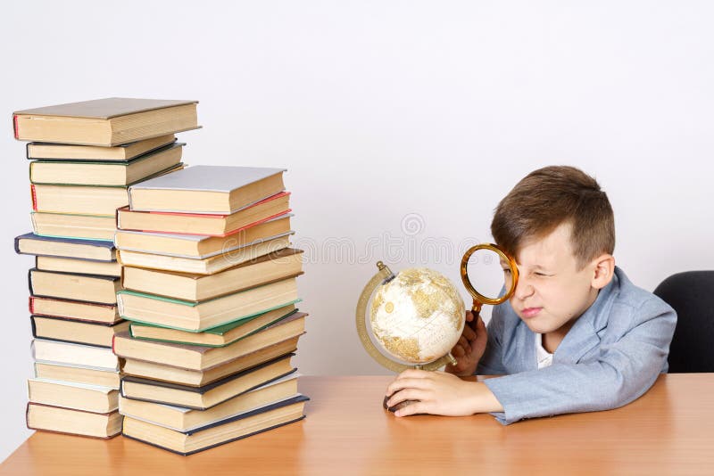 The Student Does Homework, Studies the Globe. he Has Books on Both ...