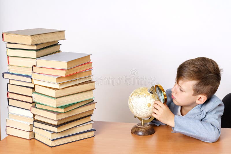 The Student Does Homework, Studies the Globe. he Has Books on Both ...