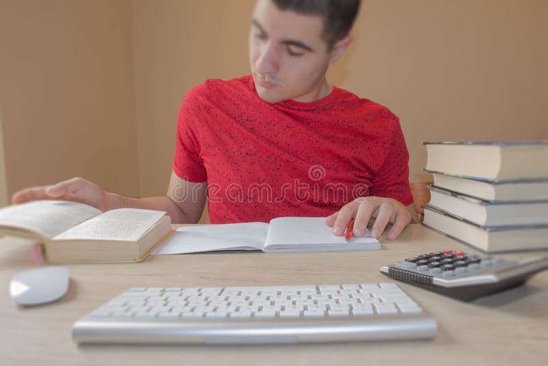Student Doing Her Homework. Education Concept - Books on the Desk in ...