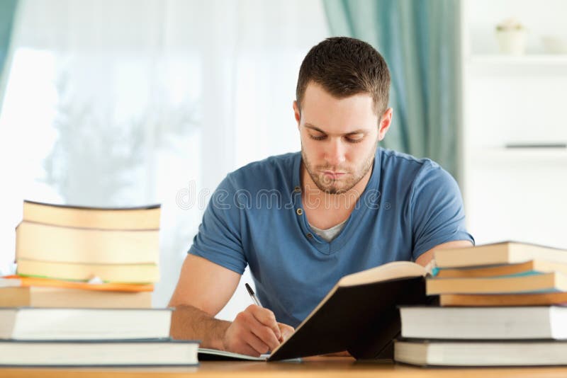 Student doing his homework stock photo. Image of research - 21984304