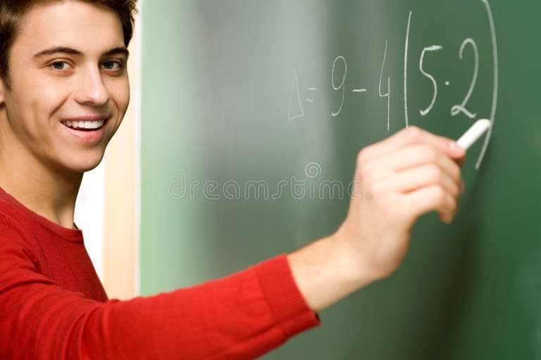 Student Doing Math on Chalkboard Stock Image - Image of holding ...