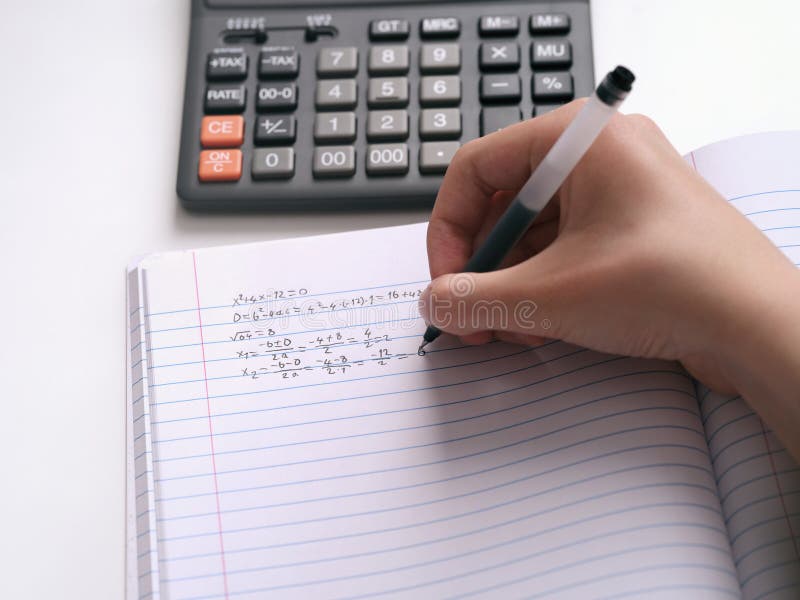 A Student Doing Math in a Notebook Stock Image - Image of science, plus ...