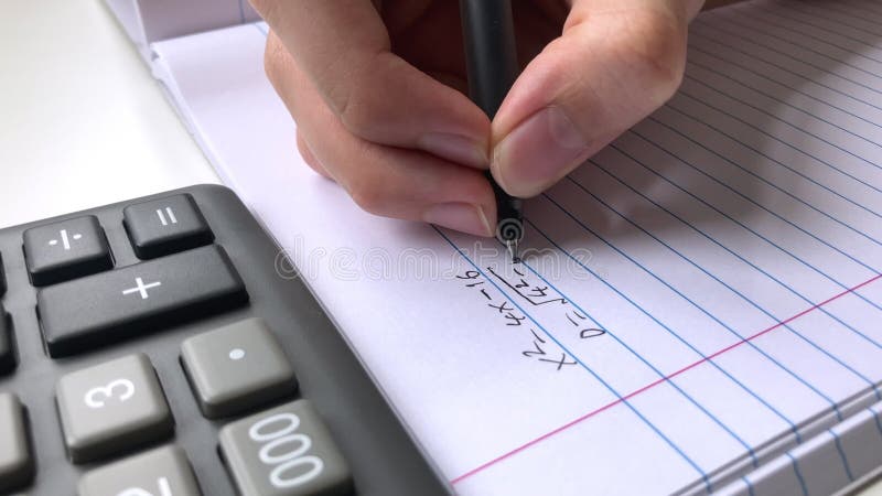 A Student Doing Math in a Notebook. Stock Video - Video of algebra ...