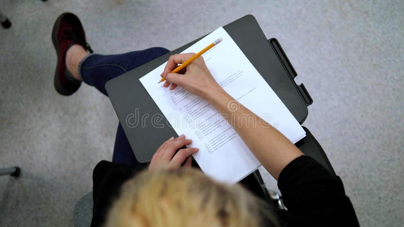 Student is Doing a Paper Test in Calssroom. Stock Photo - Image of ...