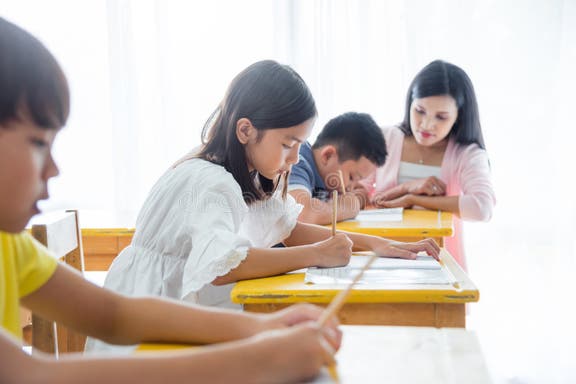 Student Doing Their Homework at School Stock Image - Image of children ...