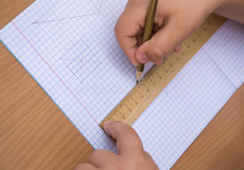The Student Draws a Straight Line in a Notebook with a Pencil Along a ...