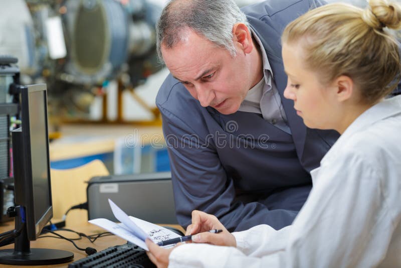 Student in Electrical Engineering Course Training with Teacher Stock ...