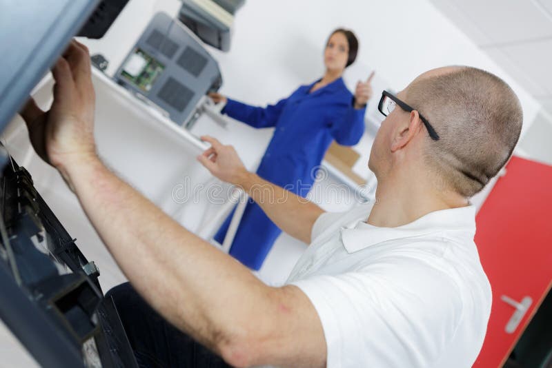 Student in Electrical Engineering Course Training with Teacher Stock ...