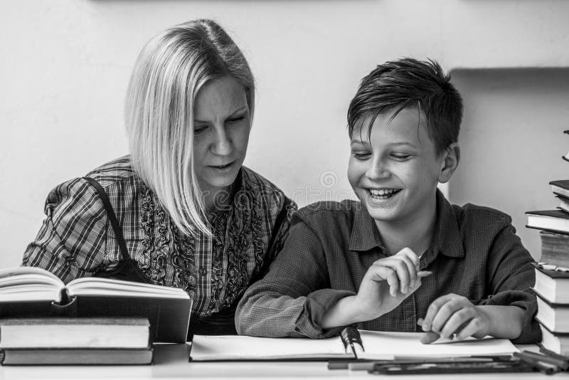 Student Elementary School during Homework with the Help of a Tutor ...