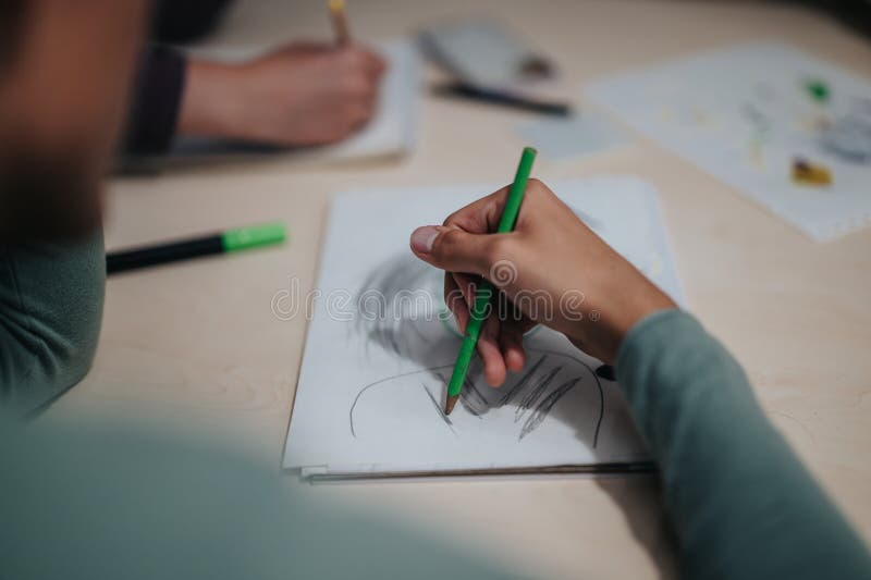Student Sketching in Classroom during Art Class Session Stock Photo ...