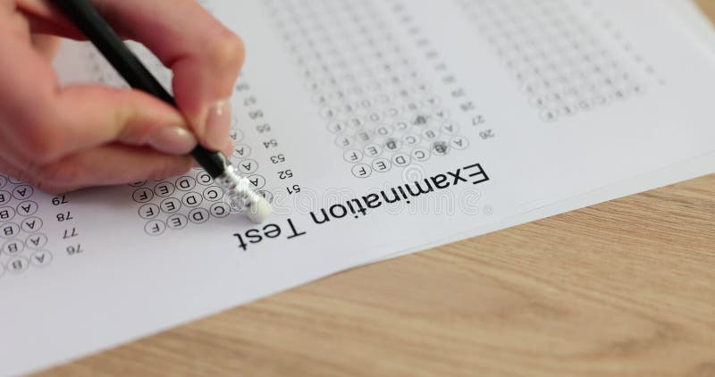 Student Erases Wrong Answer on Exam Form with Light Eraser Stock Video ...