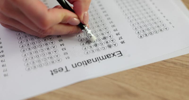 Student Erases Wrong Answer on Exam Form with Light Eraser Stock Video ...