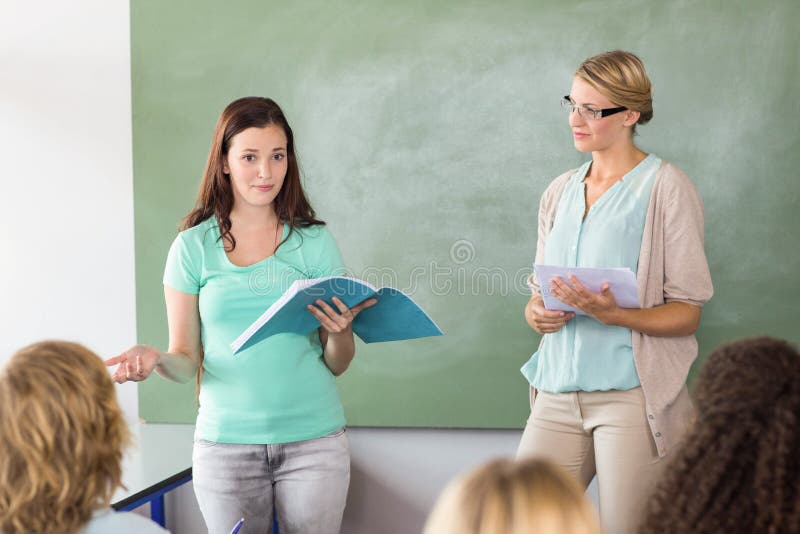 Portrait Of School Pupils Sitting On Wall Together Stock Photo - Image ...