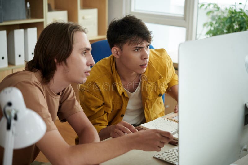 Student Explaining Topic To Friend Stock Photo - Image of screen ...