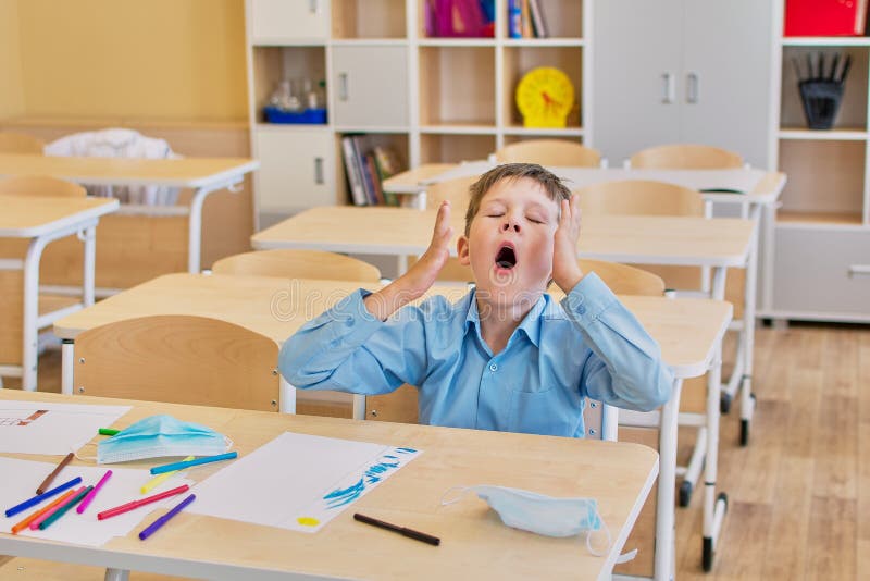 The Student Fell Asleep At His Desk, Tired Of Knowledge. Stock Image ... The Student Fell Asleep At His Desk, Tired Of Knowledge. Stock Image ...