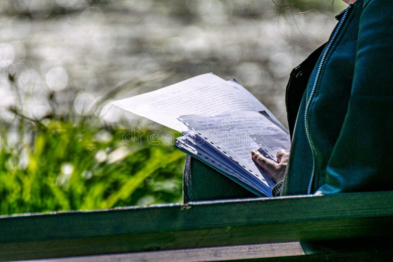 Student Female Hands with Pen Writing on Notepad on Grass Outside. Make ...