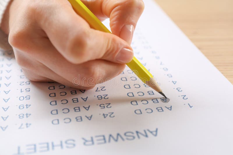 Student Filling Answer Sheet at Table Stock Photo - Image of check ...