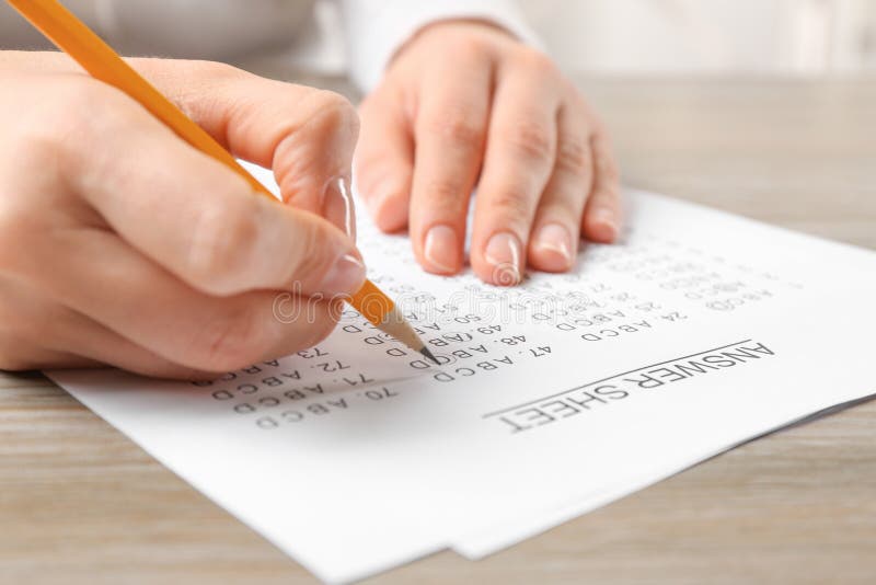 Student Filling Answer Sheet at Table Stock Photo - Image of mark ...