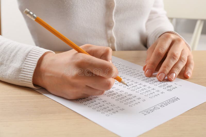 Student Filling Answer Sheet at Table Stock Image - Image of pencil ...