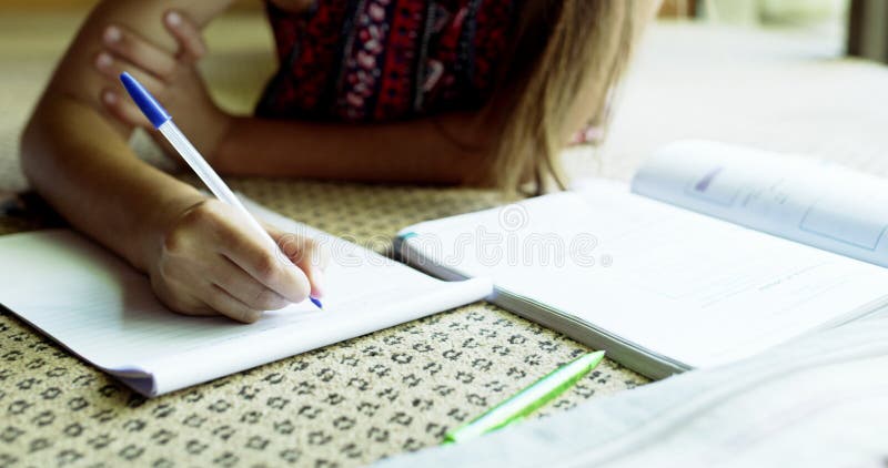 Student, Floor and Hands Writing School Work at Home for Learning Study ...