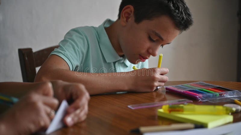 Child Engaged in a Creative School Assignment Using Colorful Stationery ...