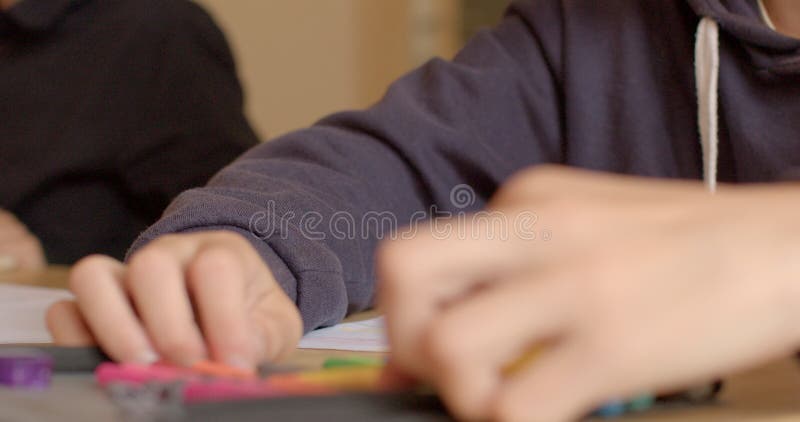 Student Focusing on Academic Studies Using Yellow Pen Classroom Improve ...