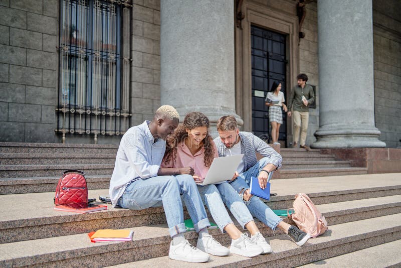 Student Friends Discussing Internet News while Sitting on the Steps ...