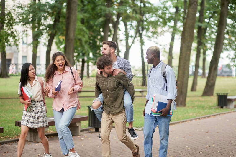 Student Friends are Having Fun Chatting on the Go . Stock Image - Image ...