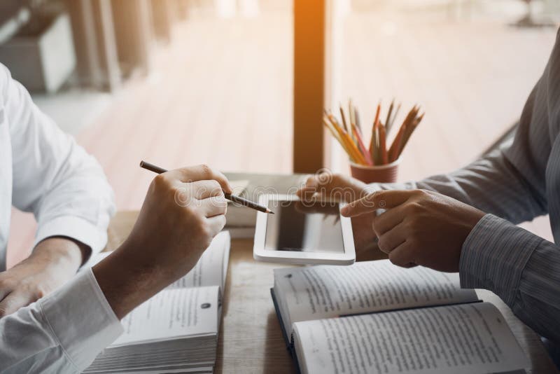 Student Friends are Using Tablets Searching for Information about ...