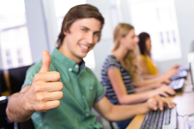 Student Gesturing Thumbs Up in Computer Class Stock Image - Image of ...