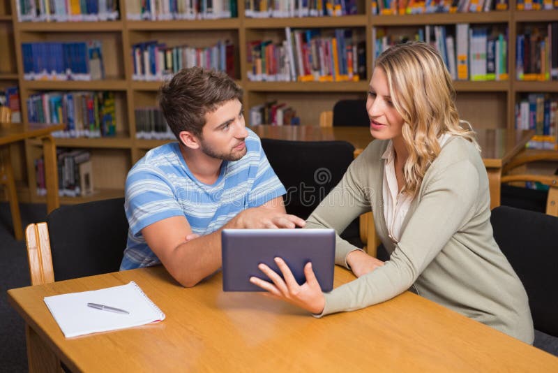 Student Getting Help from Tutor in Library Stock Image - Image of ...