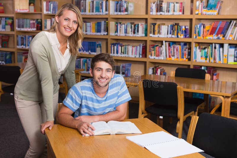 Teacher and Student in Library Stock Image - Image of adult, person ...