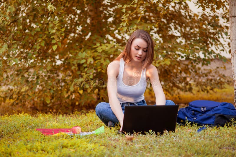 Student Girl on Grass with a Computer Stock Photo - Image of ethnicity ...