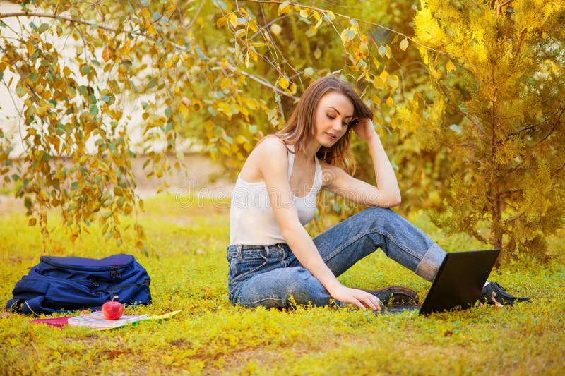 Student Girl on Grass with a Computer Stock Image - Image of back, girl ...