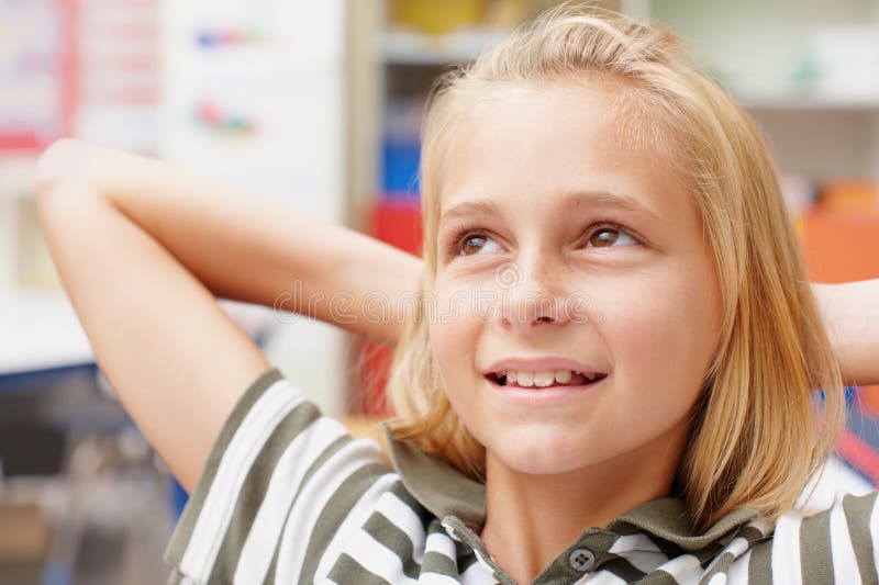Student, Girl and Happy in Classroom with Thinking at School for Education, Ideas and Learning ...