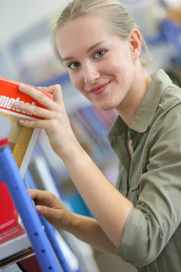 Student Girl in Library Picking Up Books Stock Photo - Image of young ...