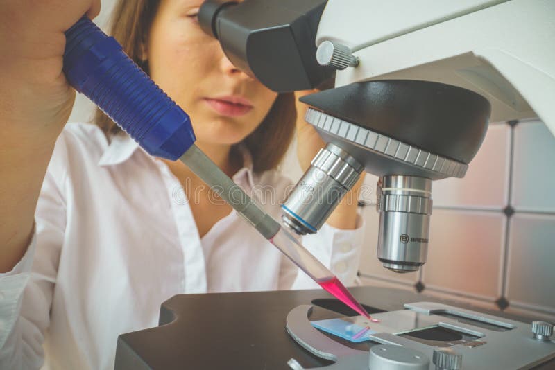 Student Girl Looking in a Microscope, Science Laboratory Concept Stock ...