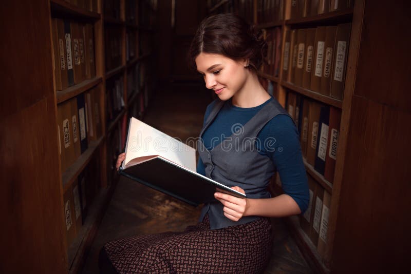 Student Girl with Open Book in University Library. Stock Photo - Image ...