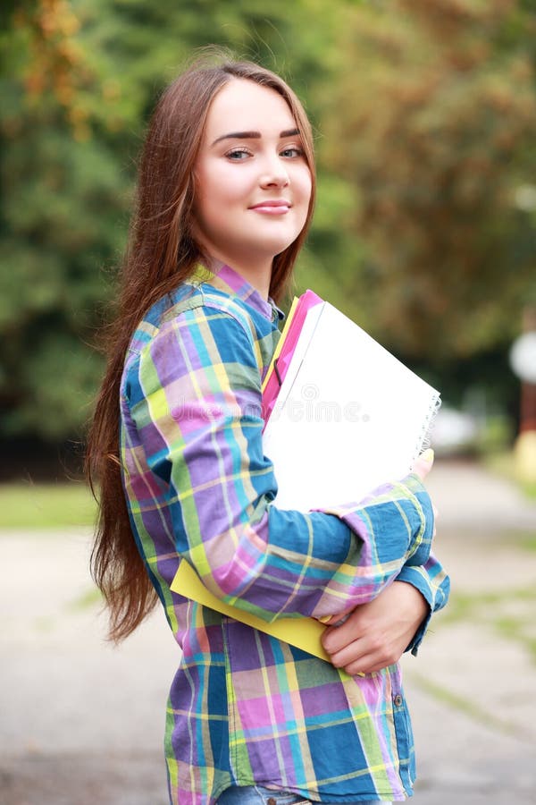 Student girl stock photo. Image of books, park, file - 58233298